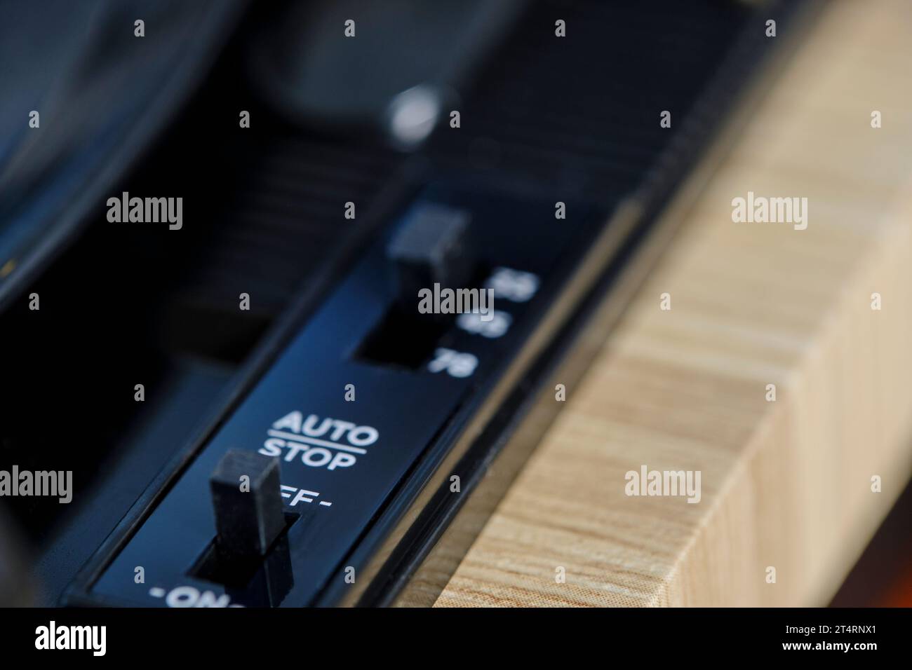 Buttons for turning on and off and switching playback speed on vinyl ...