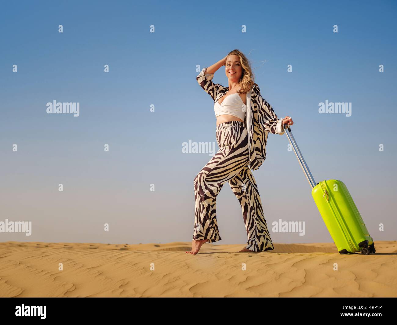 Arabian woman in stylish zebra suit with bright light green or yellow ...