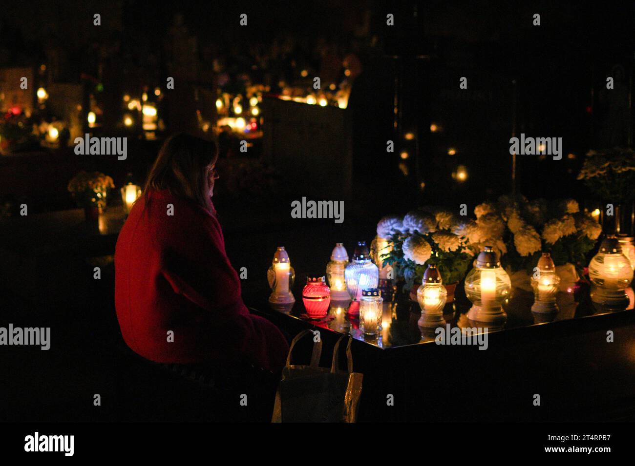 Warsaw, Poland. 01st Nov, 2023. People are seen visiting graves at a ...