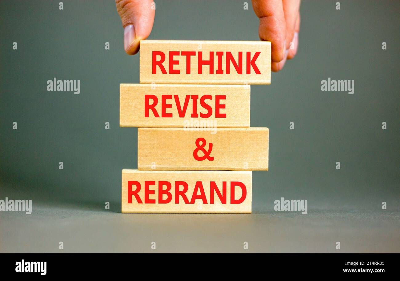 Rethink revise rebrand symbol. Concept word Rethink Revise and Rebrand on beautiful block ...