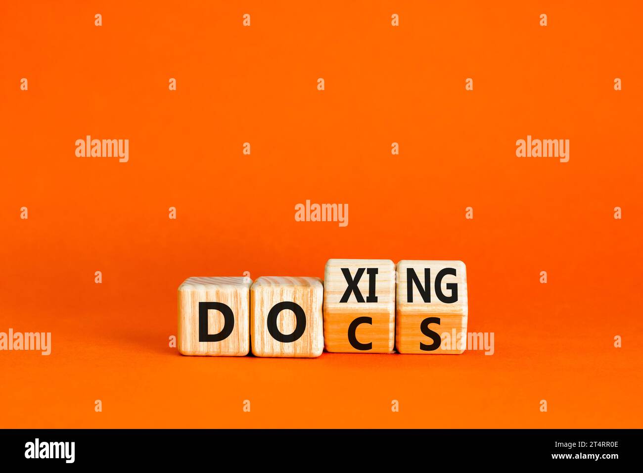Docs or doxing symbol. Concept words Docs Doxing on wooden block ...