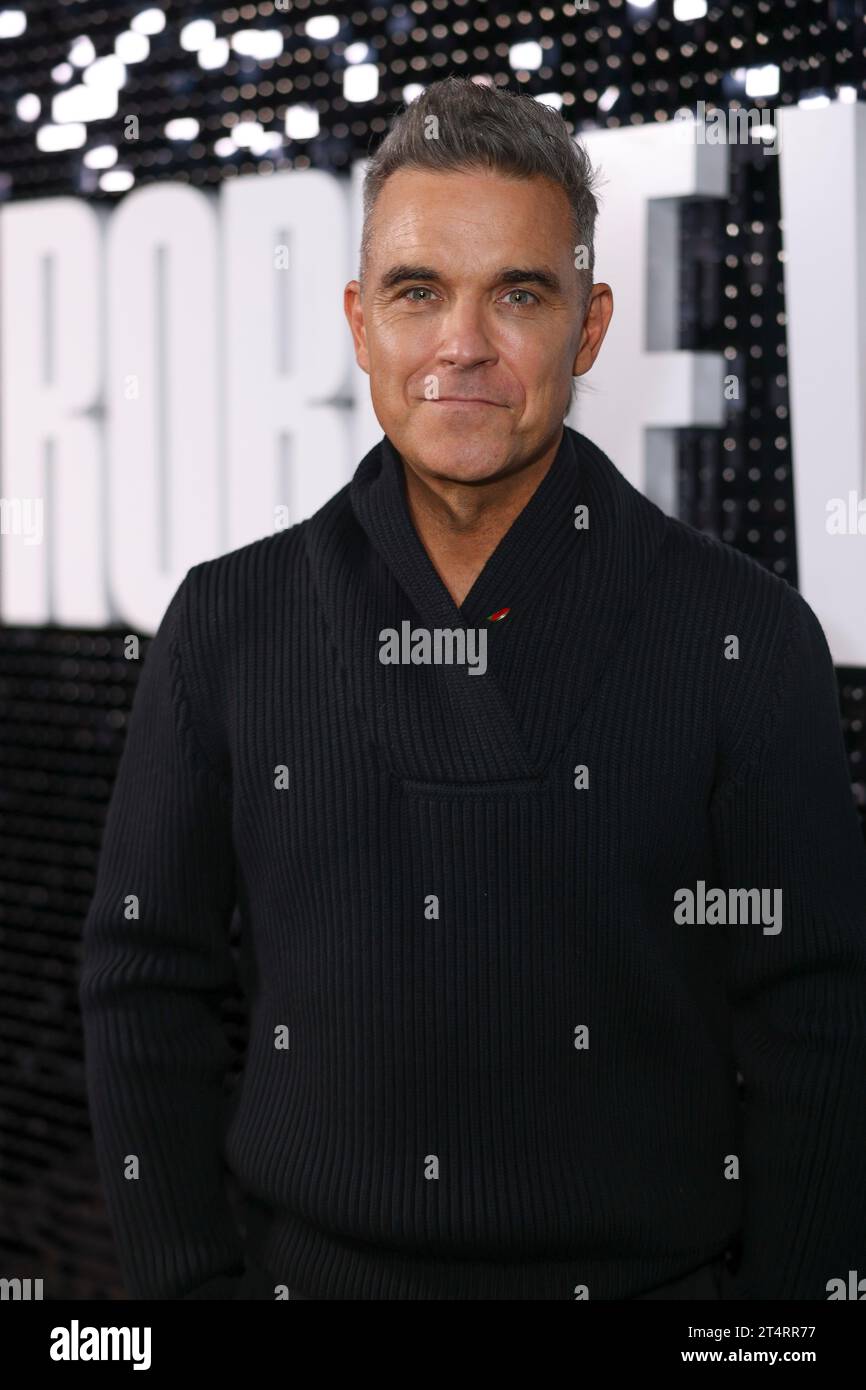 Robbie Williams poses for photographers upon arrival at the premiere ...