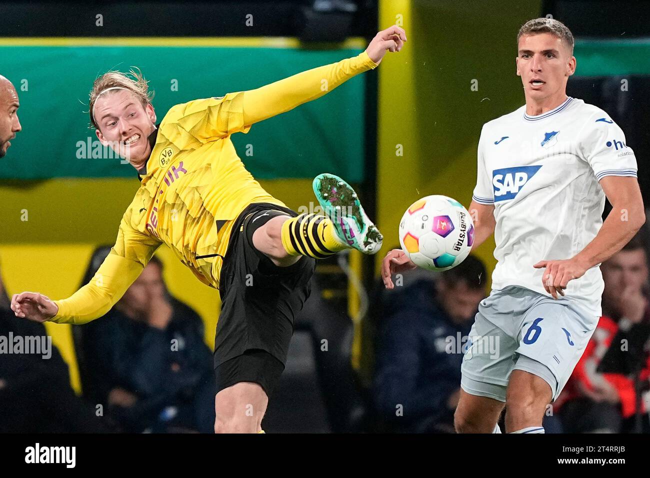 Dortmund's Julian Brandt, left, is challenged by Hoffenheim's Grischa ...