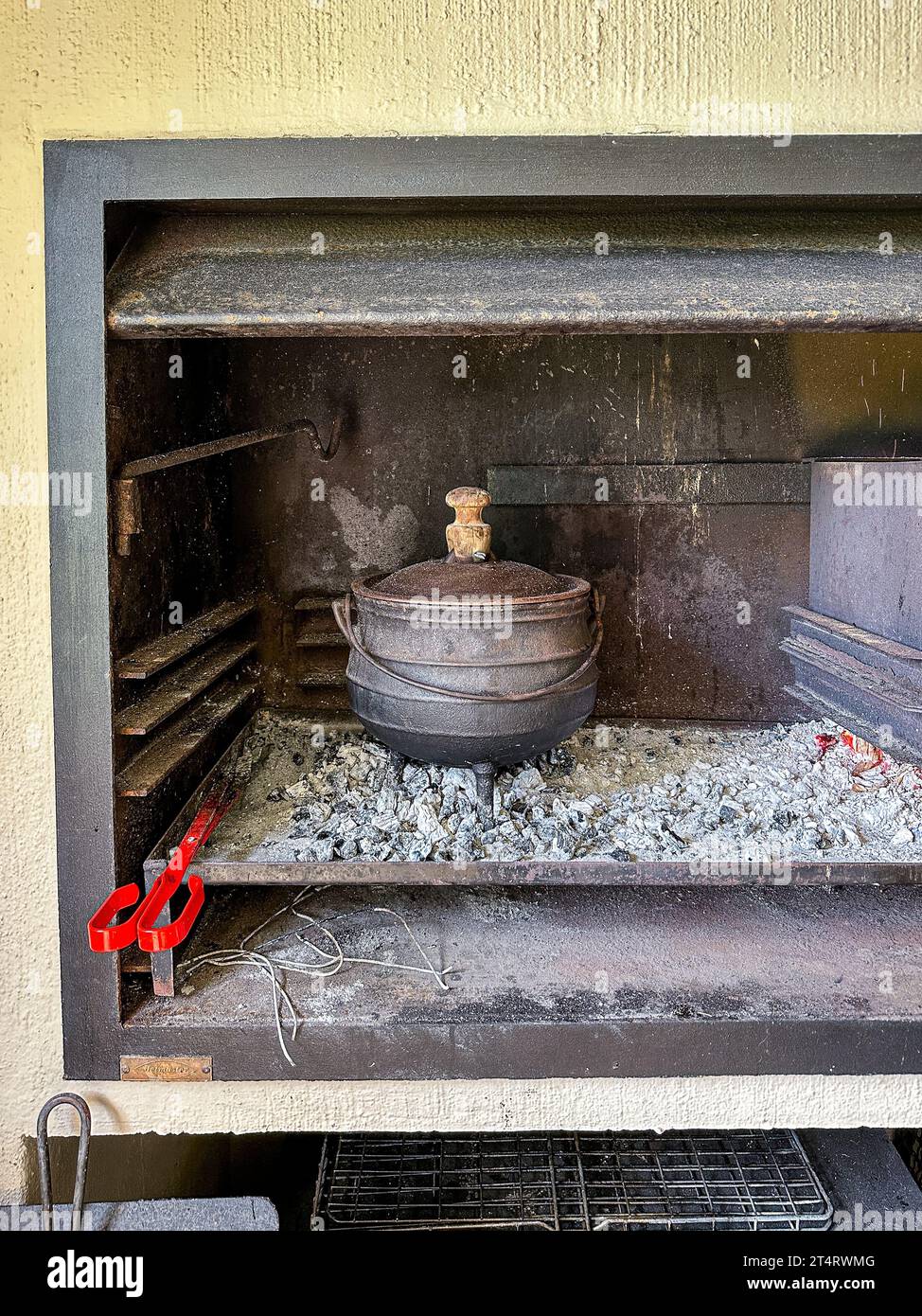 A round, cast iron, three-legged cauldron, called the potjie, used to ...