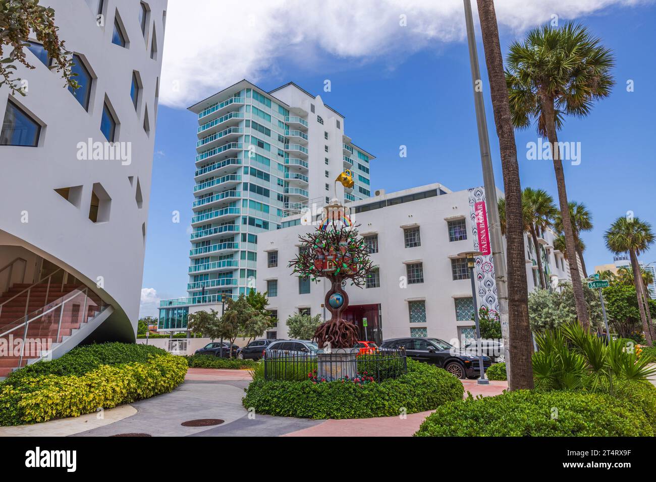 Tree-shaped statue adorned with locks, set against backdrop of charming ...