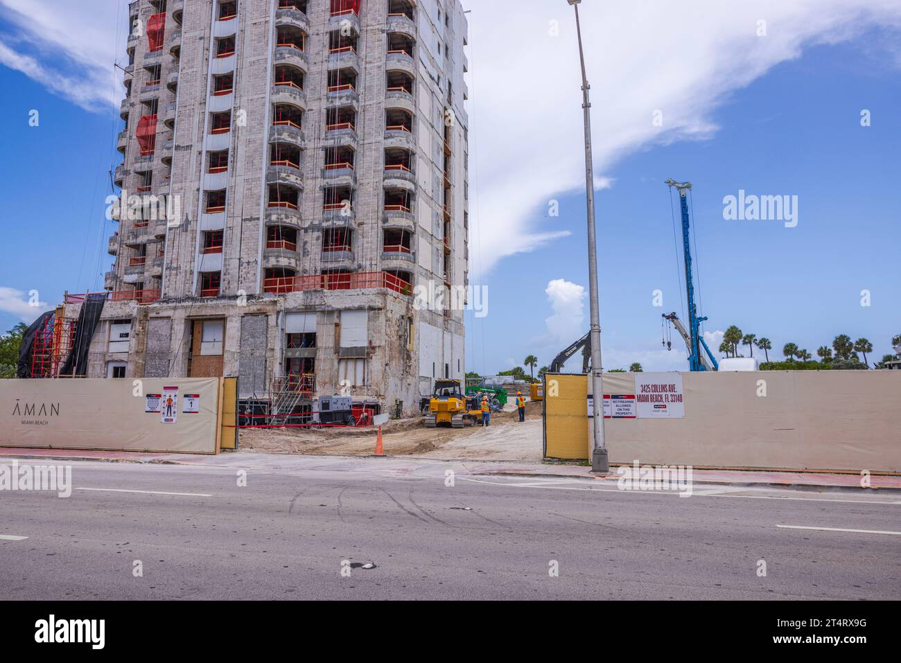 View of construction site with machinery and workers on Collins Avenue ...