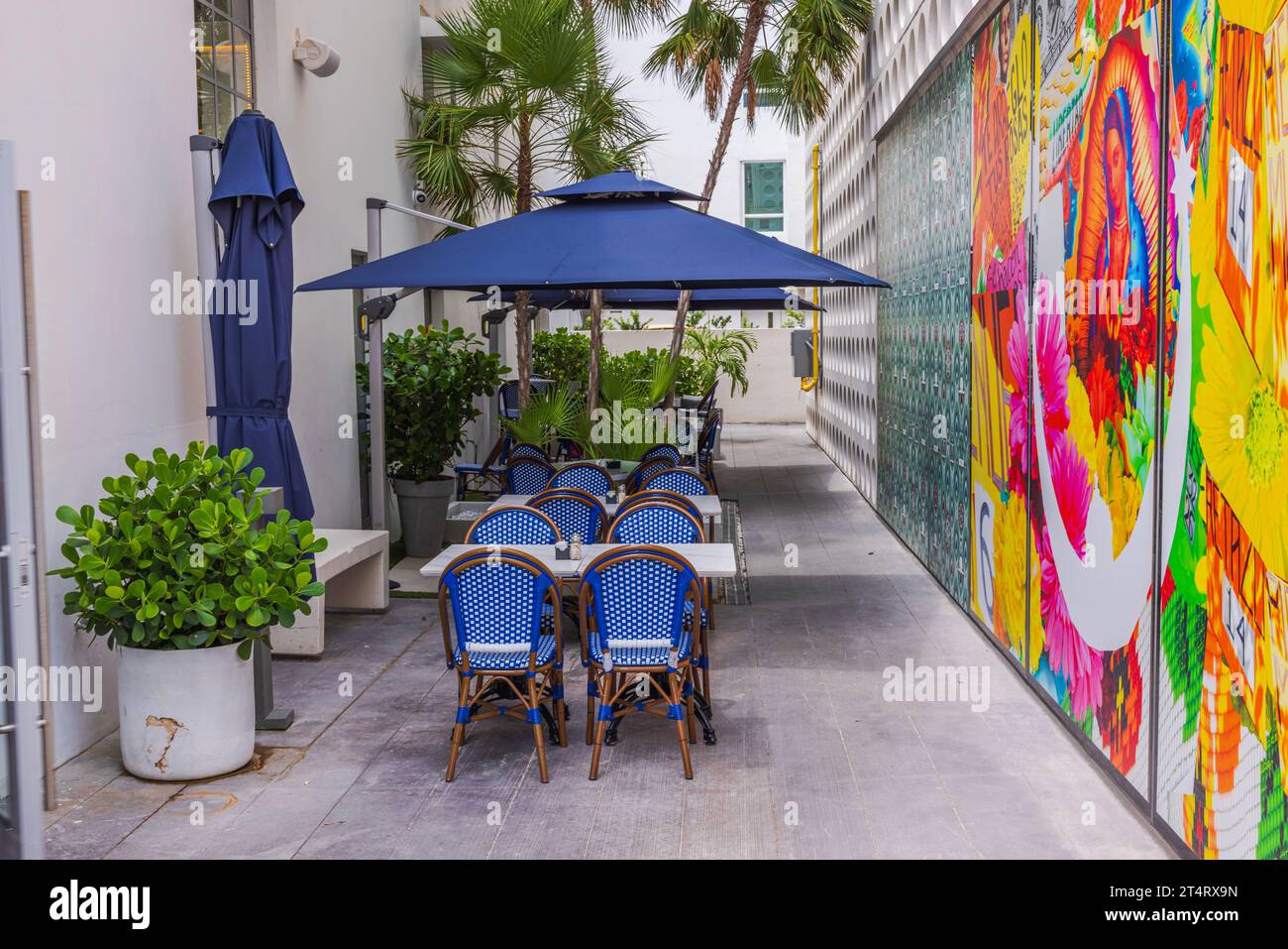 Inviting exterior restaurant at hotel, with neatly arranged tables for ...
