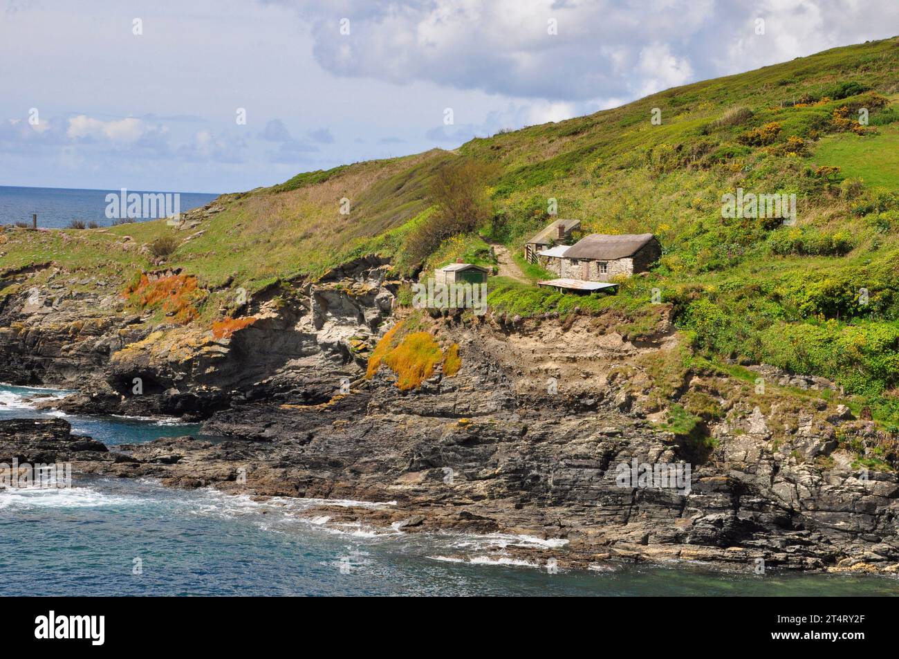Spring sunshine lights Prussia cove near Marizion in Cornwall ...