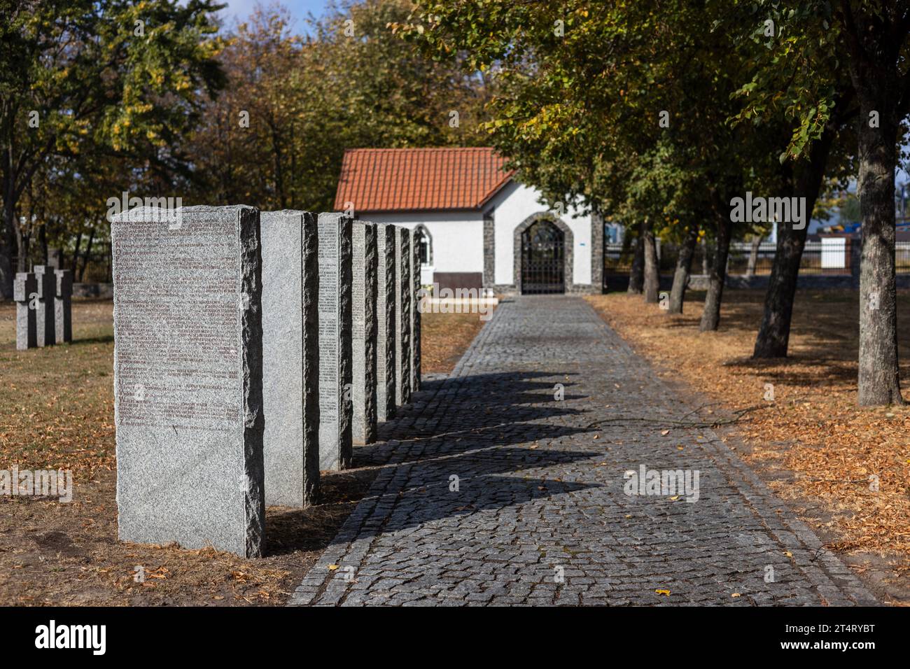 Stone tombstones in the German cemetery in the fall. Beautiful German ...
