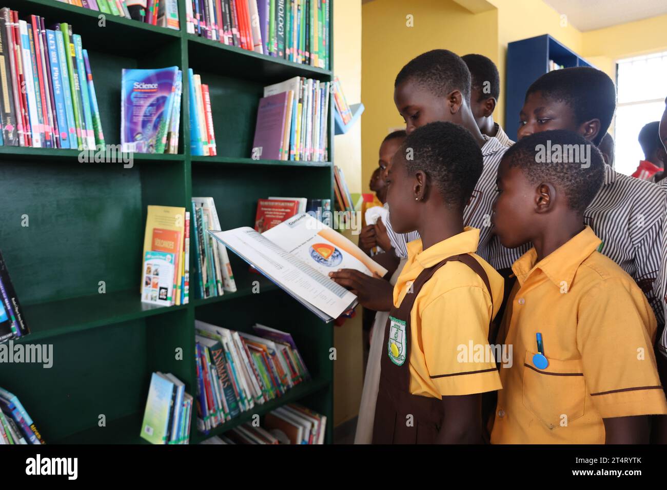 Accra, Ghana. 31st Oct, 2023. Students read a book at a multimedia ...