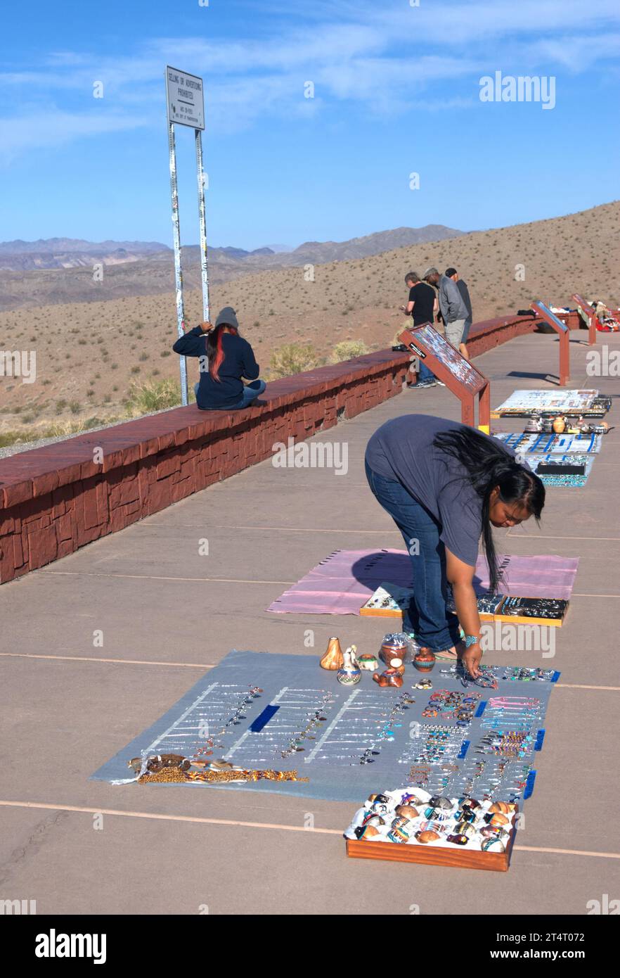 Native American woman selling handcrafted artifacts and jewelry by Lake ...