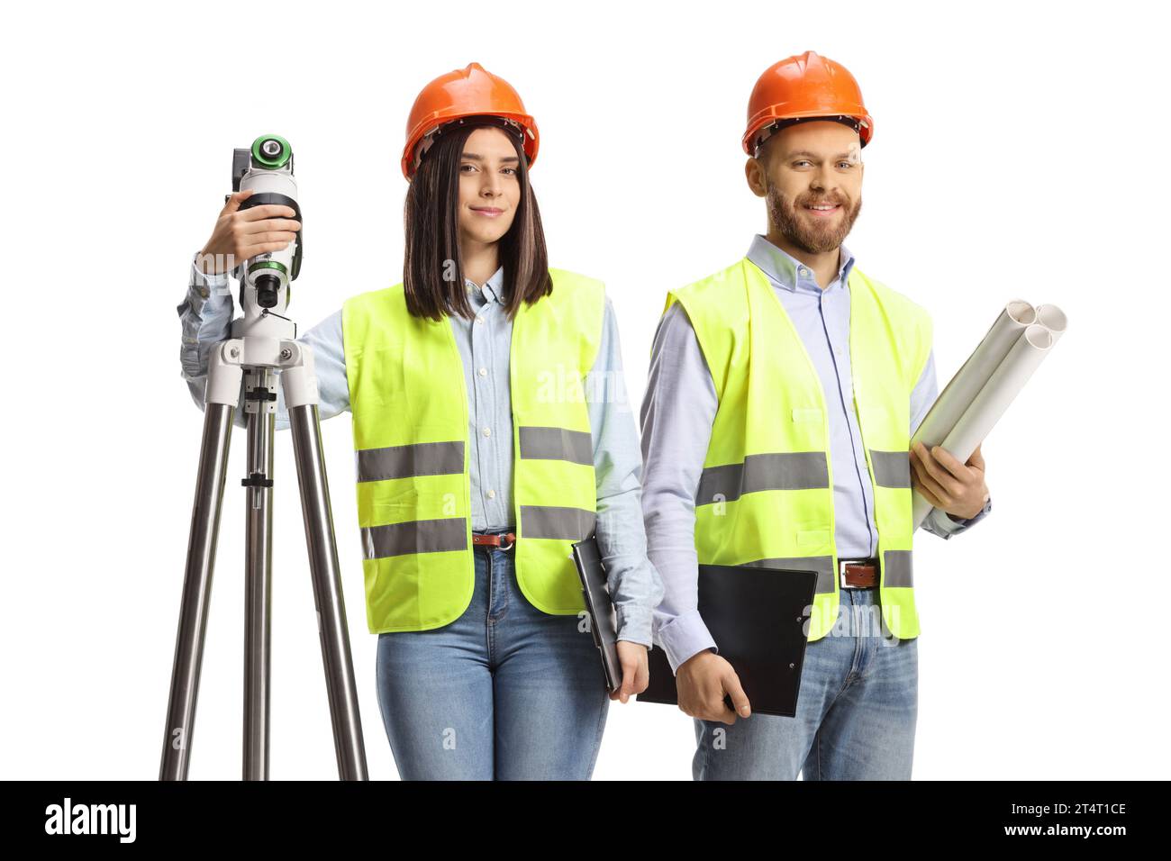 Female geodetic surveyor with a measuring device and a male engineer ...
