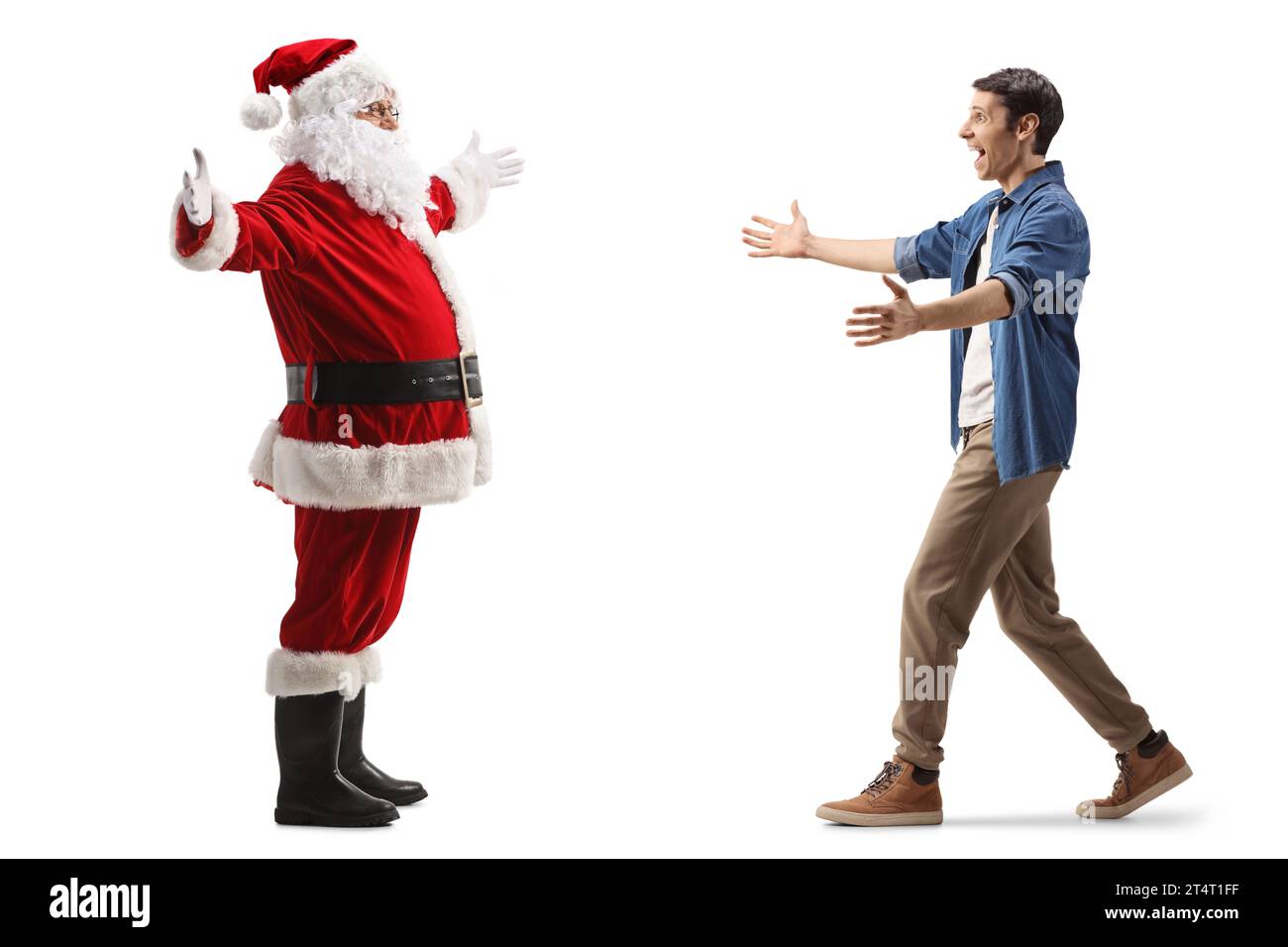 Full length profile shot of santa claus waiting to hug a young man ...