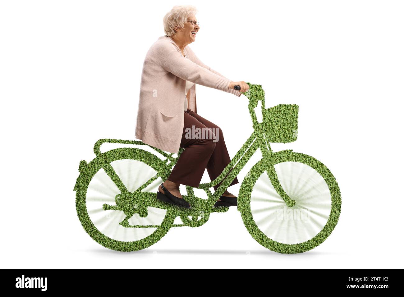 Senior woman riding a green bicycle isolated on white background ...