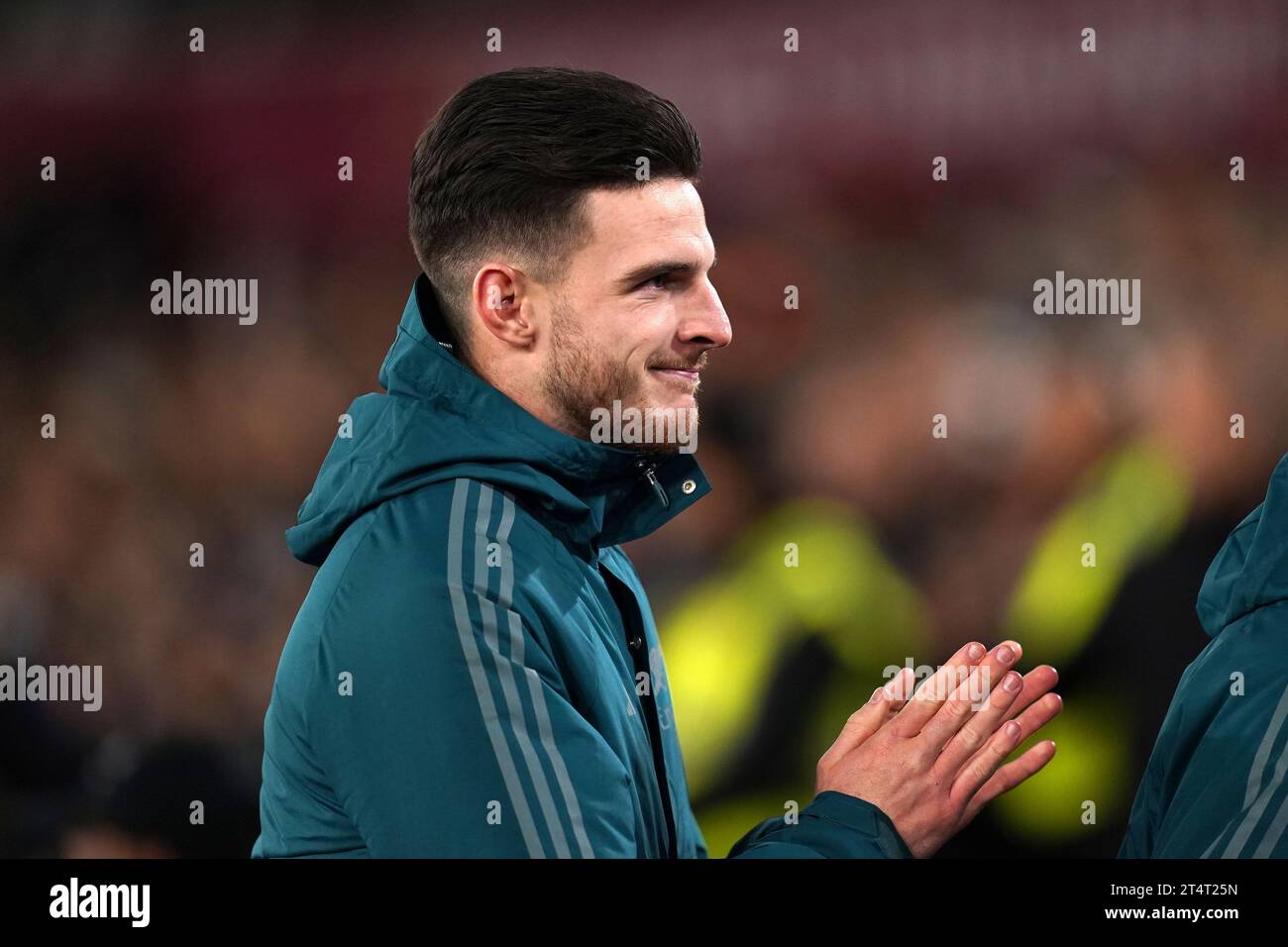 Arsenal's Declan Rice acknowledges the fans while sat on the bench ...