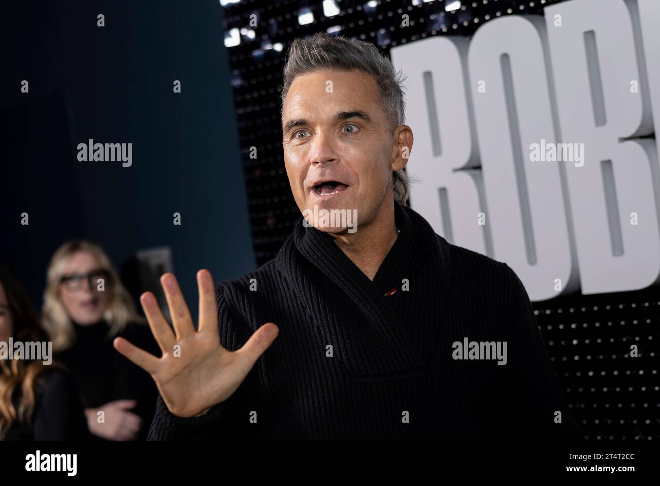 Robbie Williams poses for photographers upon arrival at the premiere ...