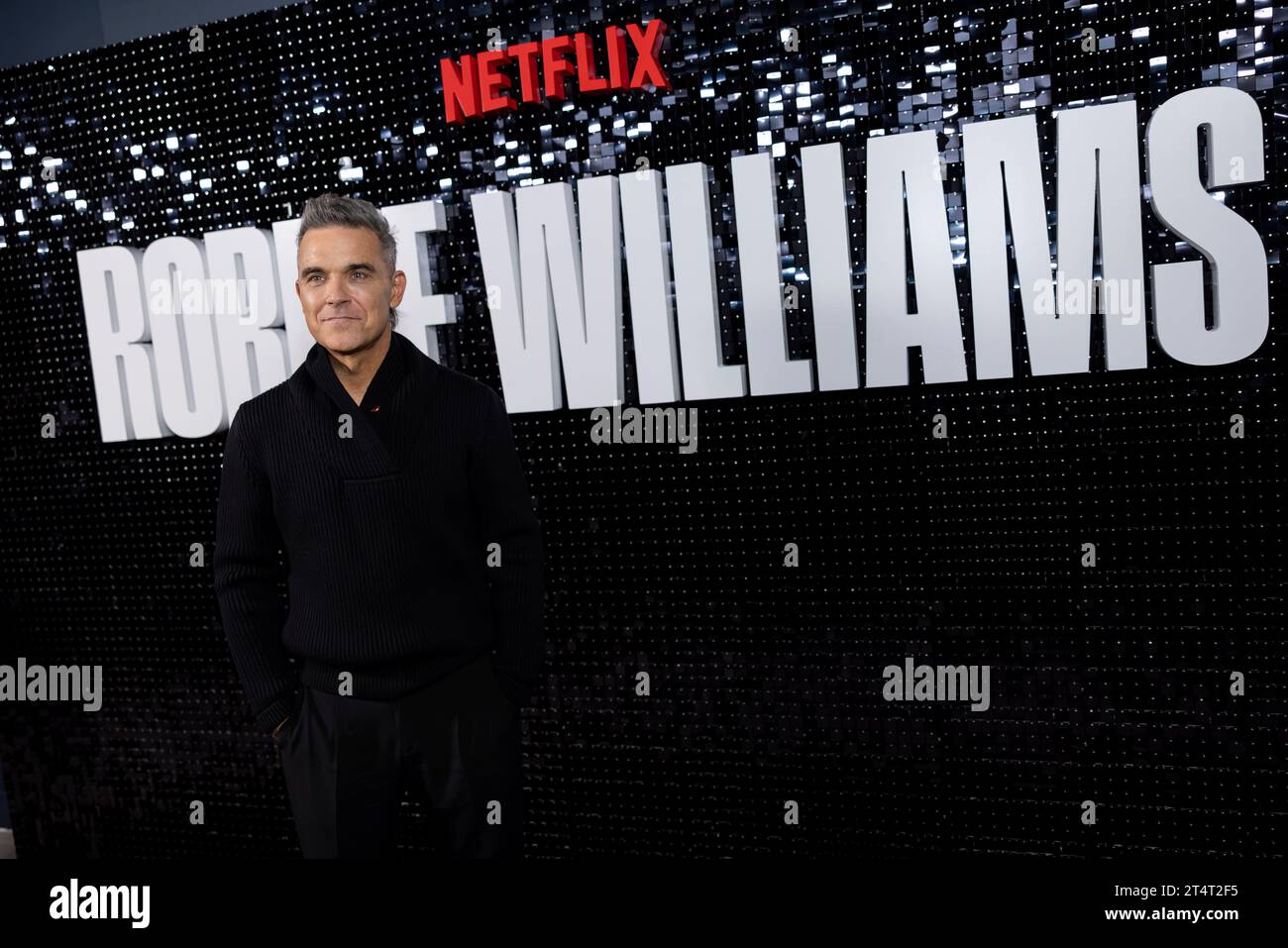 Robbie Williams poses for photographers upon arrival at the premiere ...