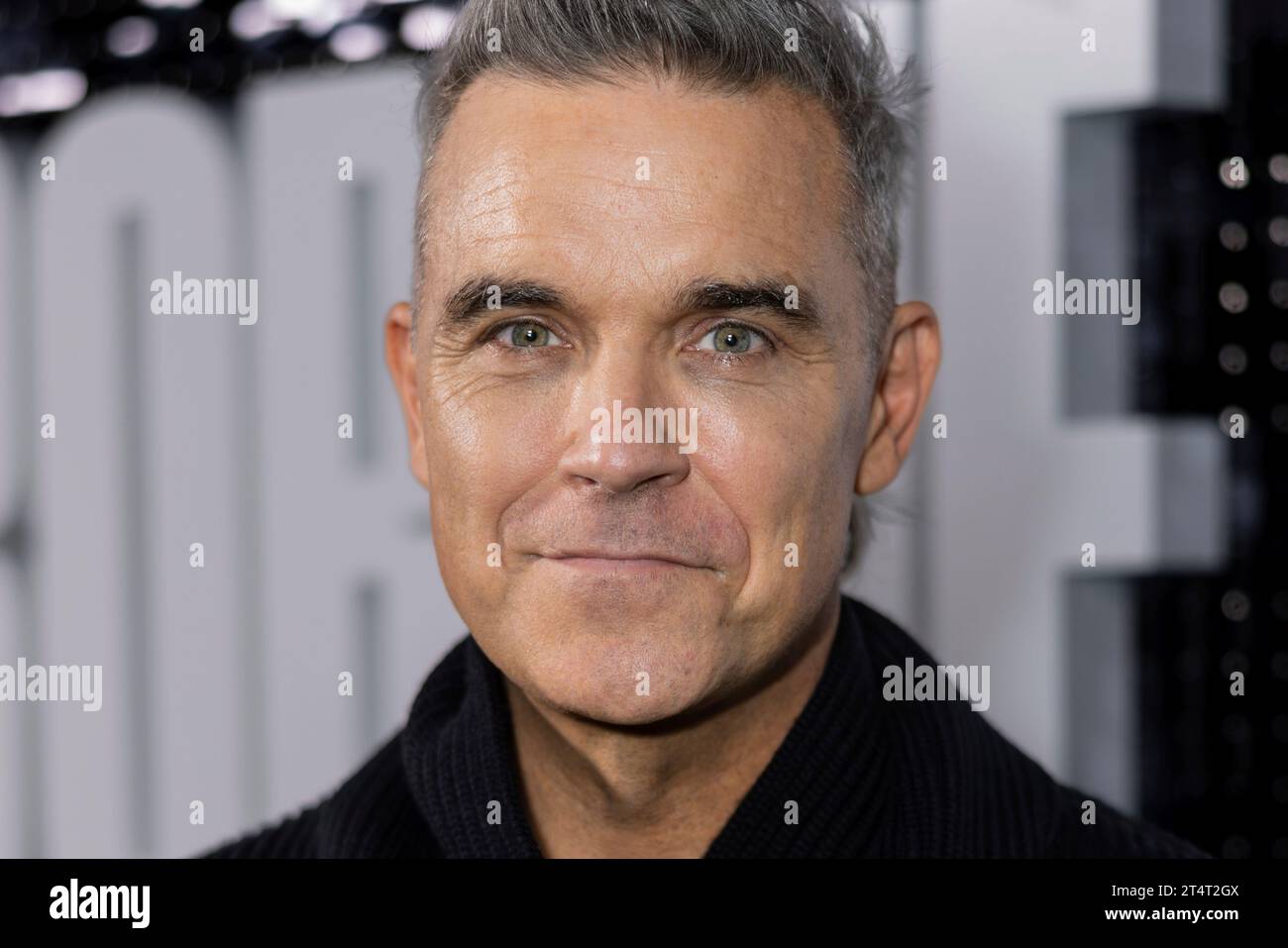 Robbie Williams poses for photographers upon arrival at the premiere ...