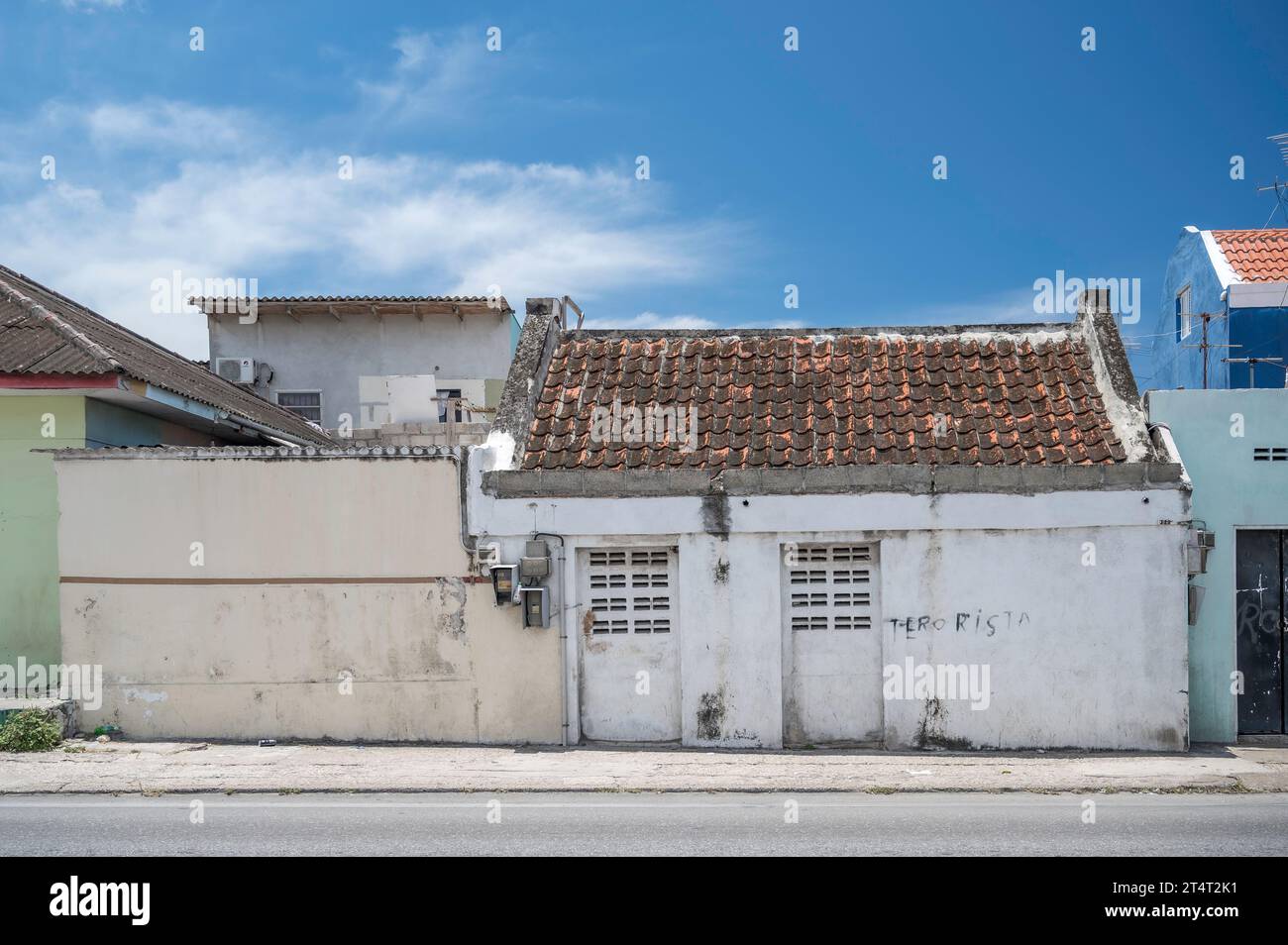 An old, derelict building on the tropical, Caribbean island of Curacao ...