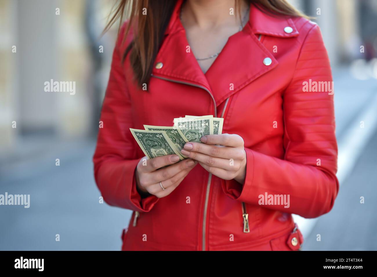 Counting money on street woman hi-res stock photography and images - Alamy