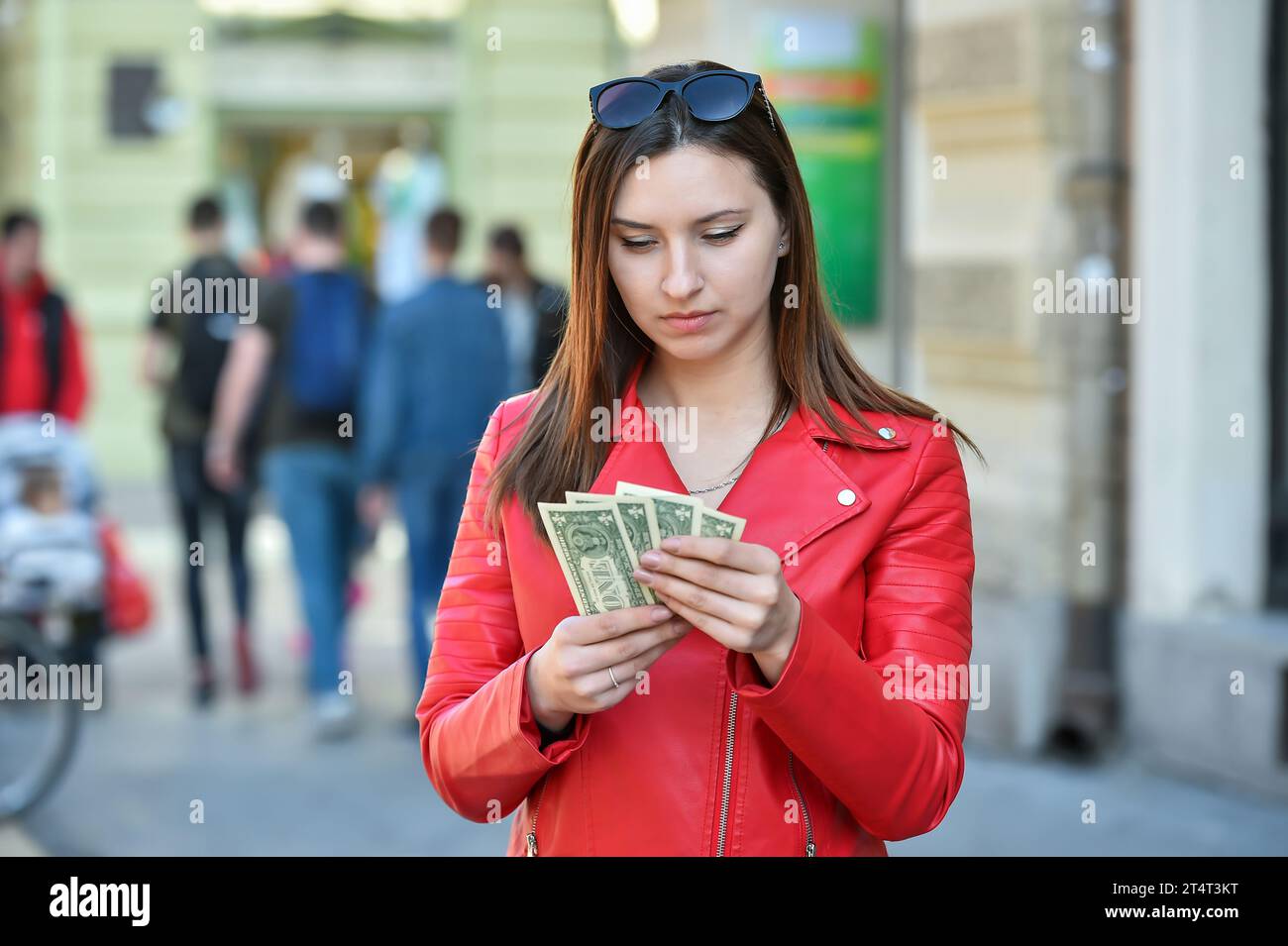 Counting money on street woman hi-res stock photography and images - Alamy