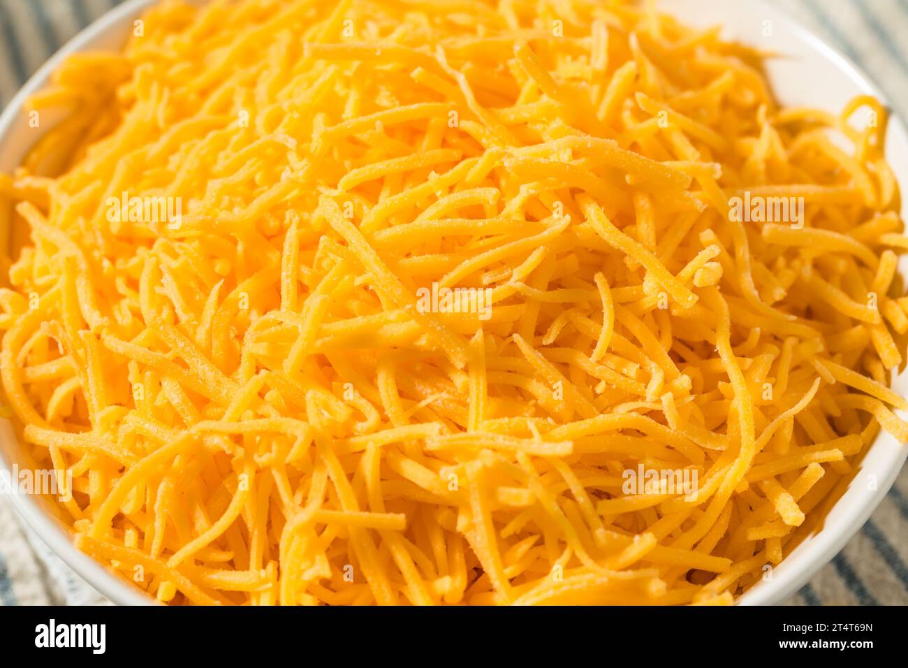 Organic raw shredded cheddar hi-res stock photography and images - Alamy