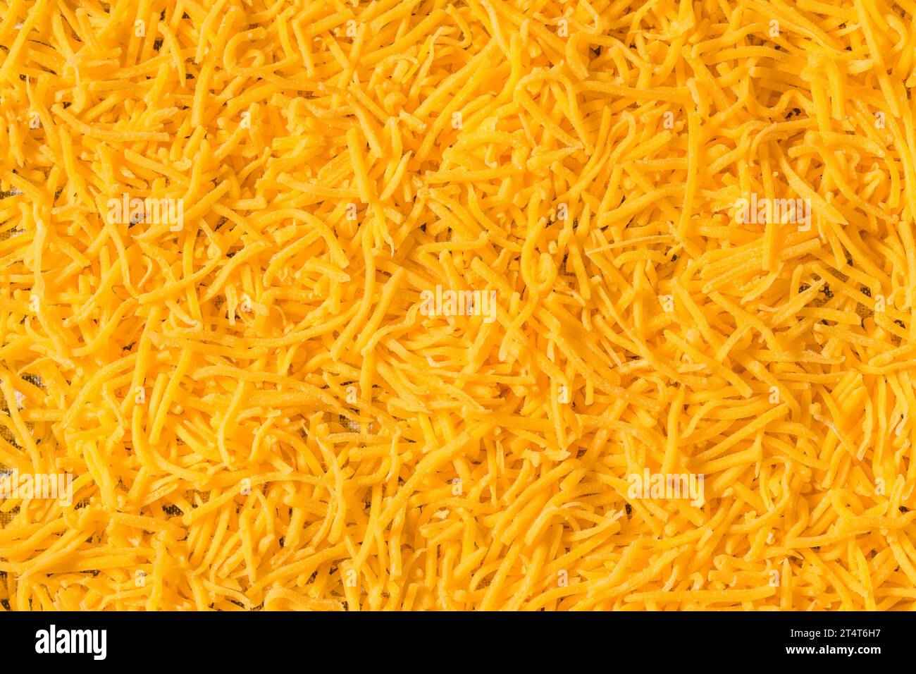 Organic Raw Shredded Cheddar Cheese in a Bowl Stock Photo - Alamy