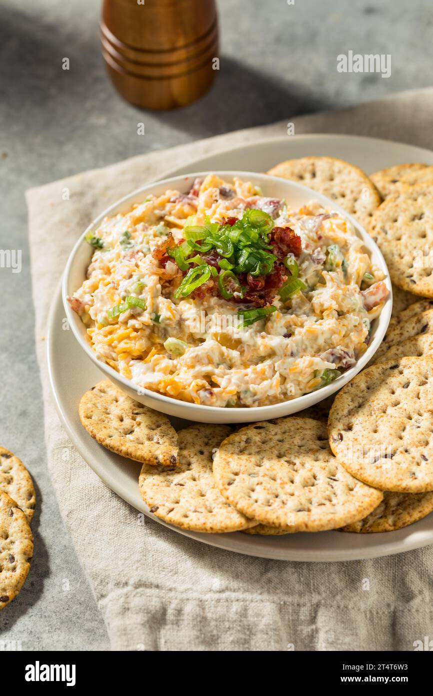 Homemade Million Dollar Cheese Dip with Bacon and Crackers Stock Photo ...