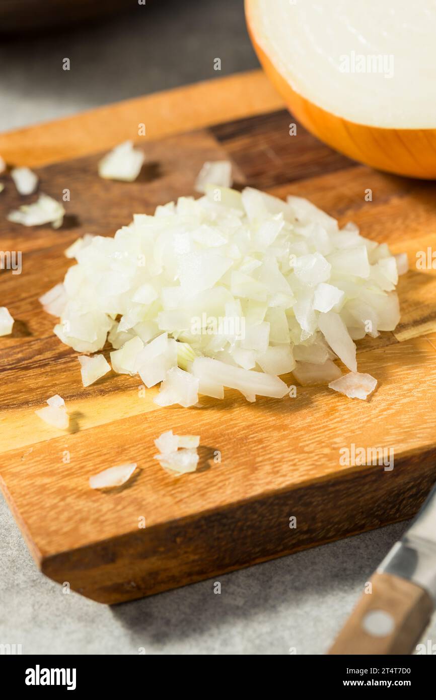 Cutting onion on board hi-res stock photography and images - Alamy