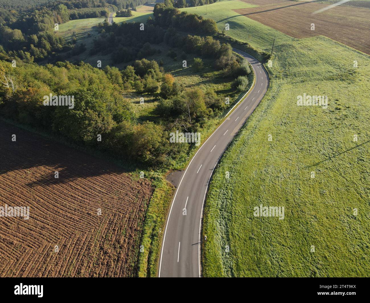 Aerial view of a road between country fields in the landscape Stock ...