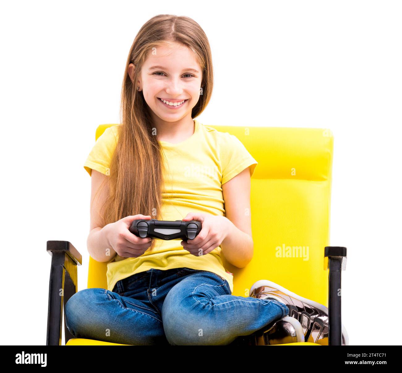Pretty teen girl sitting, holding black joystick, playing console for ...