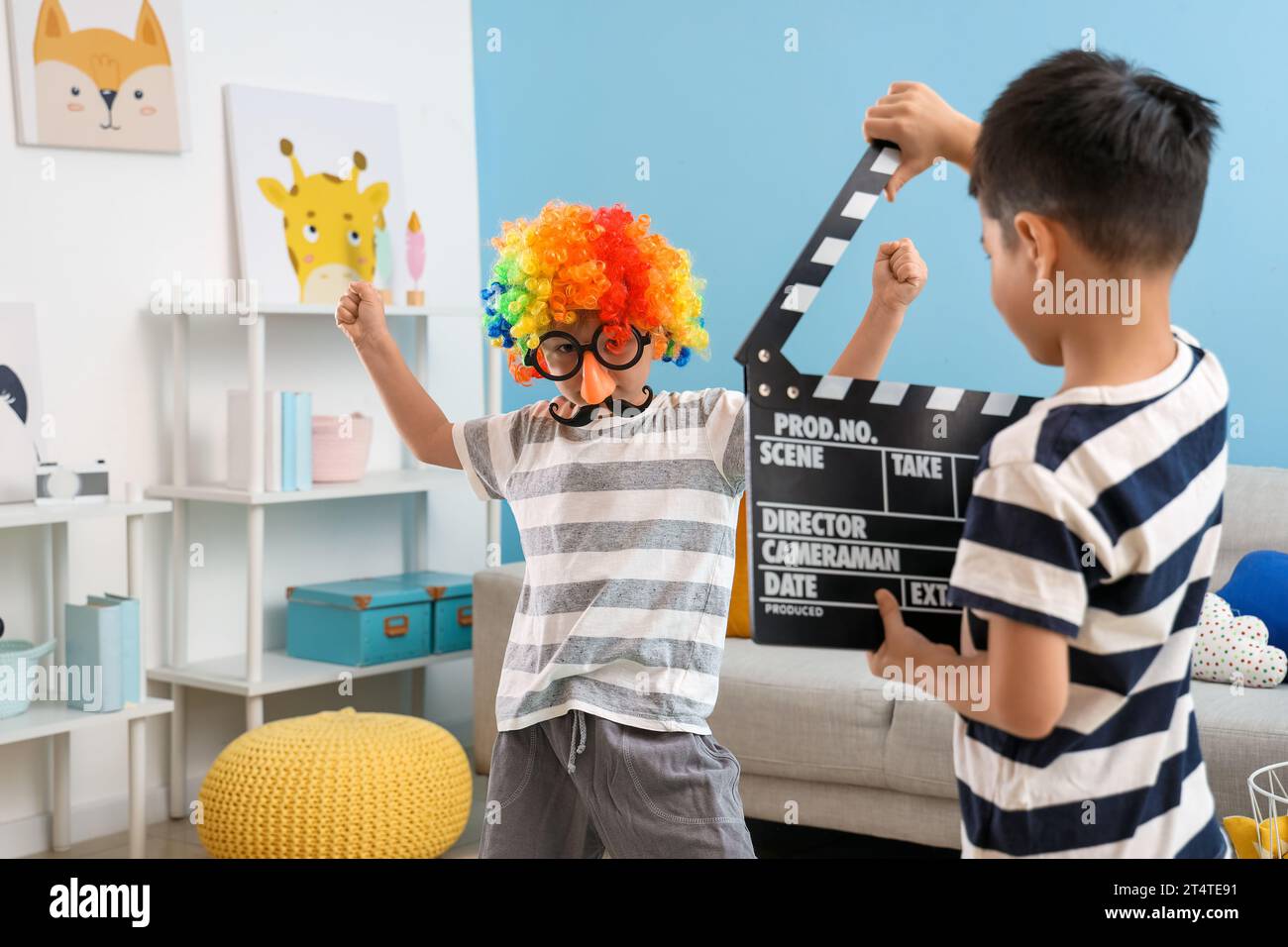Cute little boys playing with movie clapper at home Stock Photo - Alamy