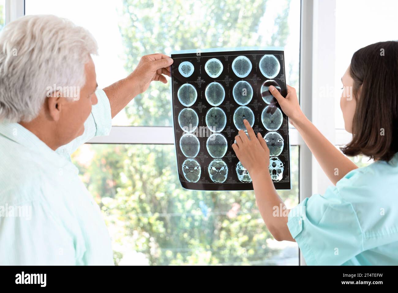 Male neurologist doctor inspecting hi-res stock photography and images ...