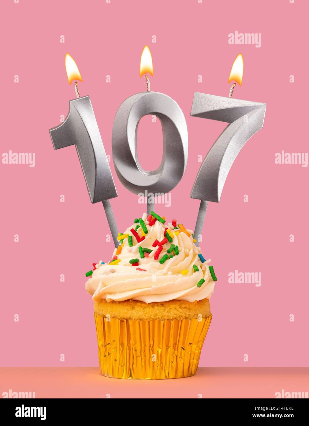 Birthday card with cupcake and candle number 107 Stock Photo - Alamy