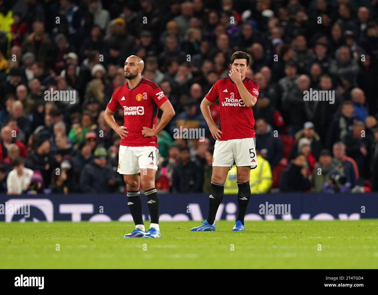 Manchester United's Sofyan Amrabat and Harry Maguire reacts after ...