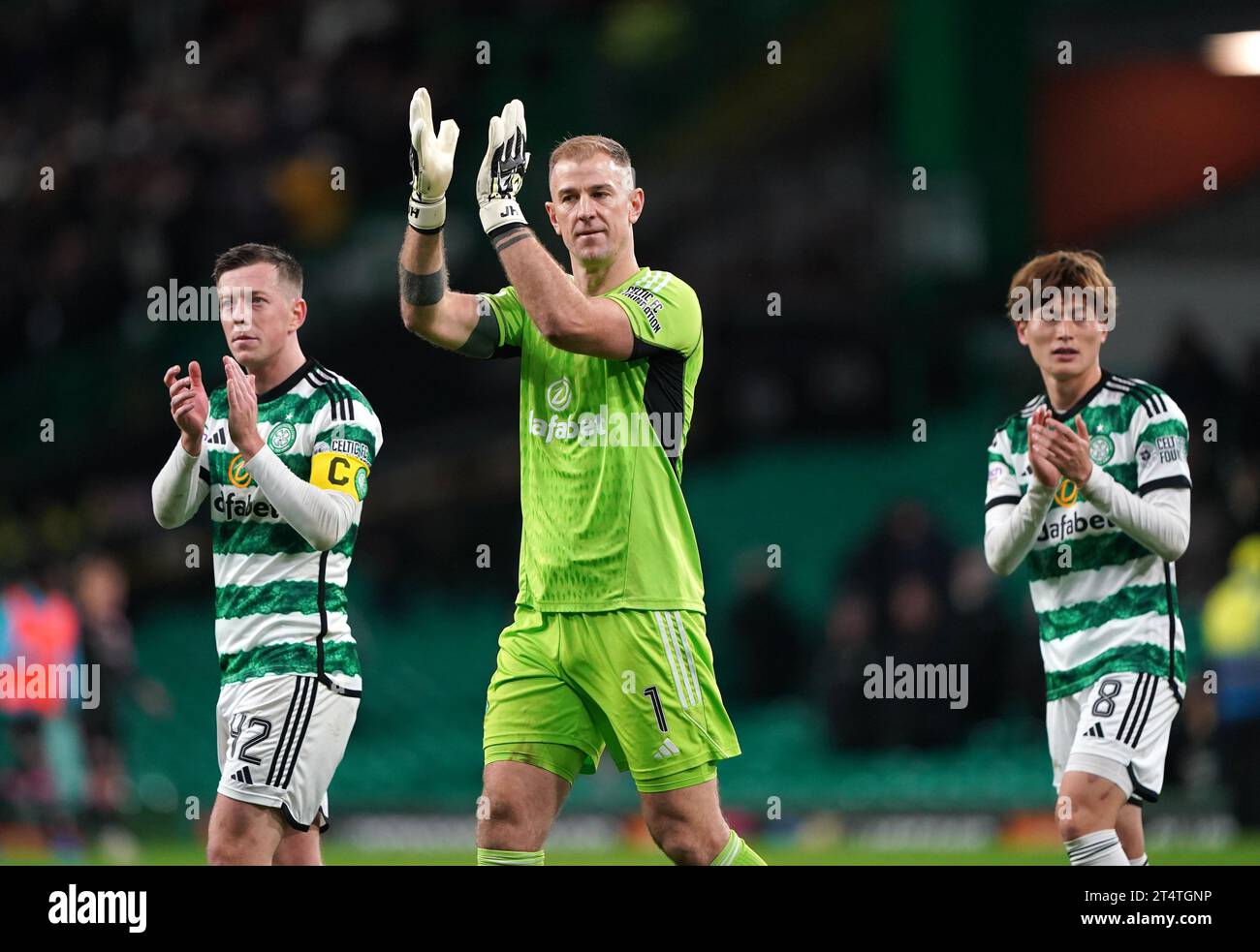 Celtic goalkeeper Joe Hart (centre) applauds the fans following during ...