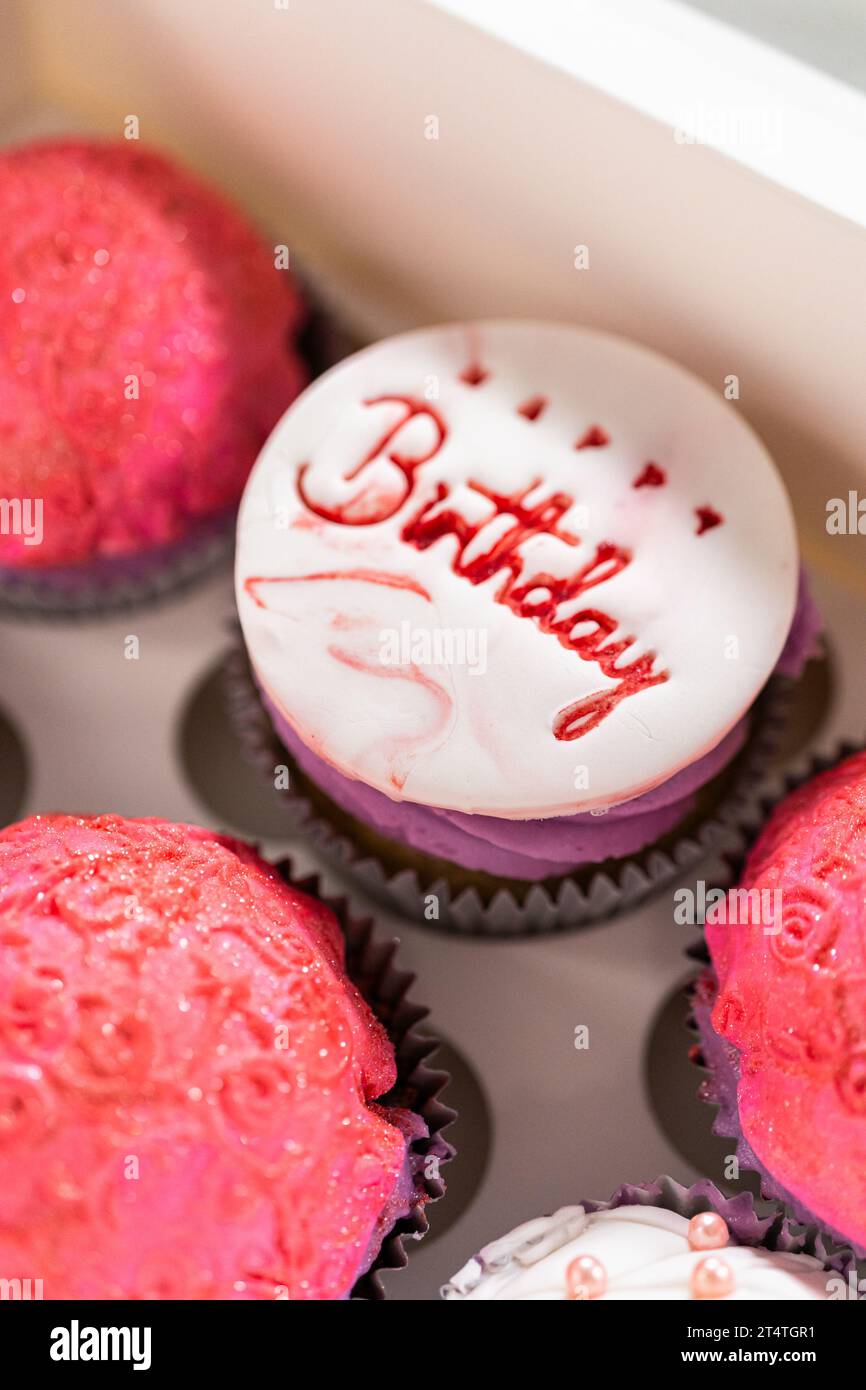 Creating Extravagant Cupcakes for Birthday Celebration Stock Photo - Alamy