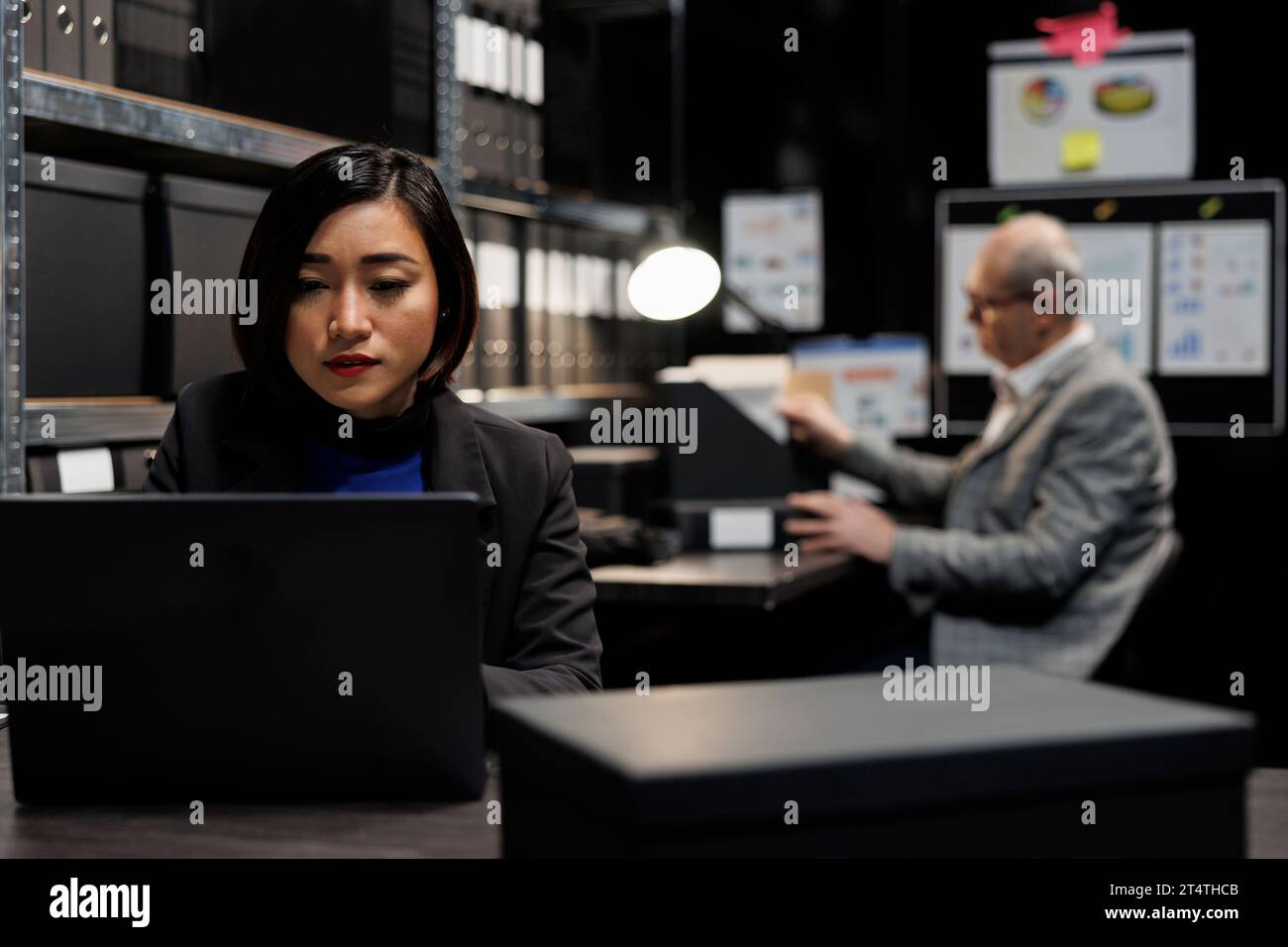 Professional business workers checking administrative analytical data ...