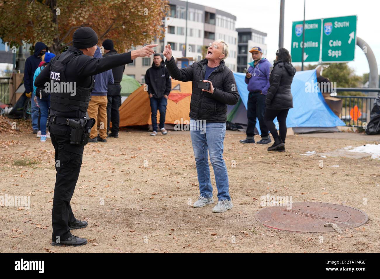 Homeless advocate Amy Beck, center, confronts a Denver Police ...