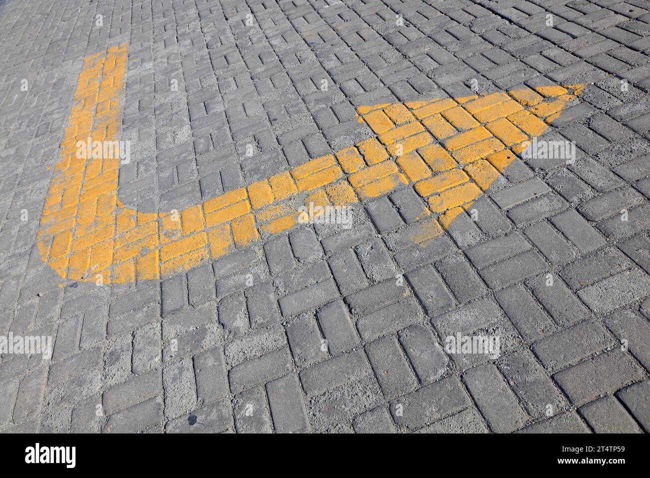 bend arrow marks on the floor tile, closeup of photo Stock Photo - Alamy