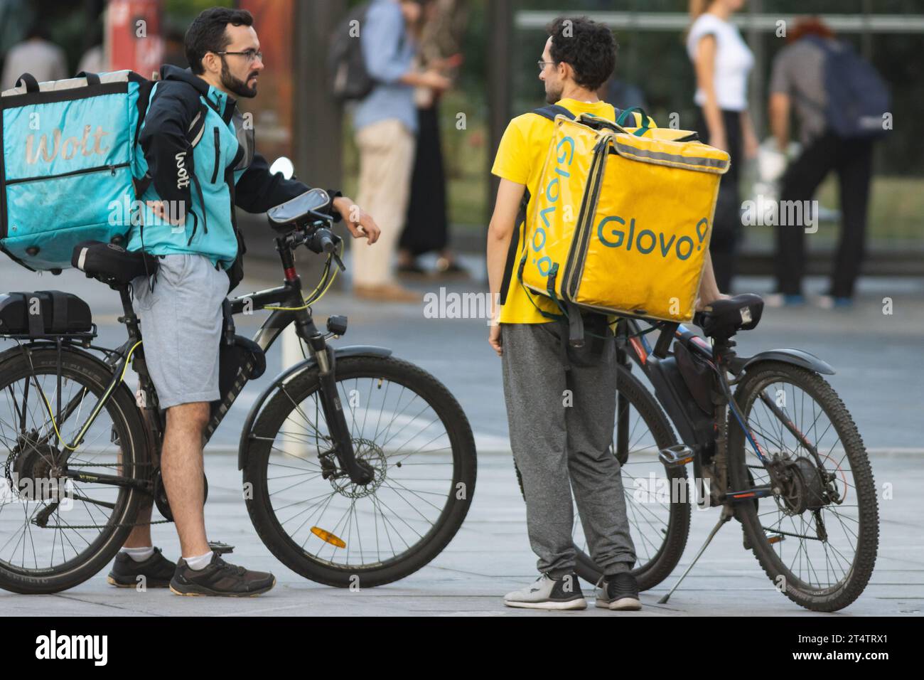 29 september 2023, Belgrade, Serbia - two men on bicycles - carriers of ...