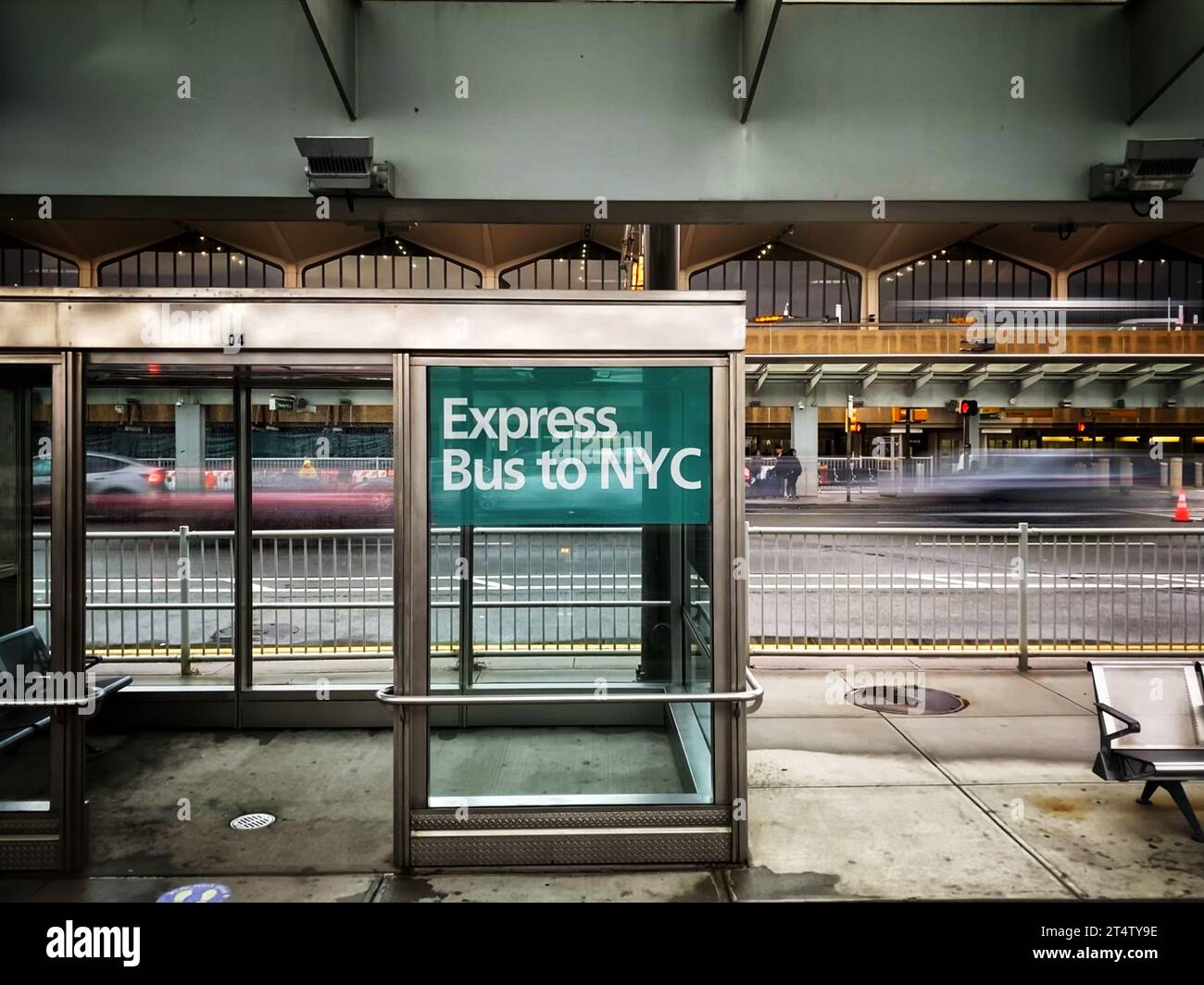 Express bus to NYC, bus shelter at airport Stock Photo - Alamy