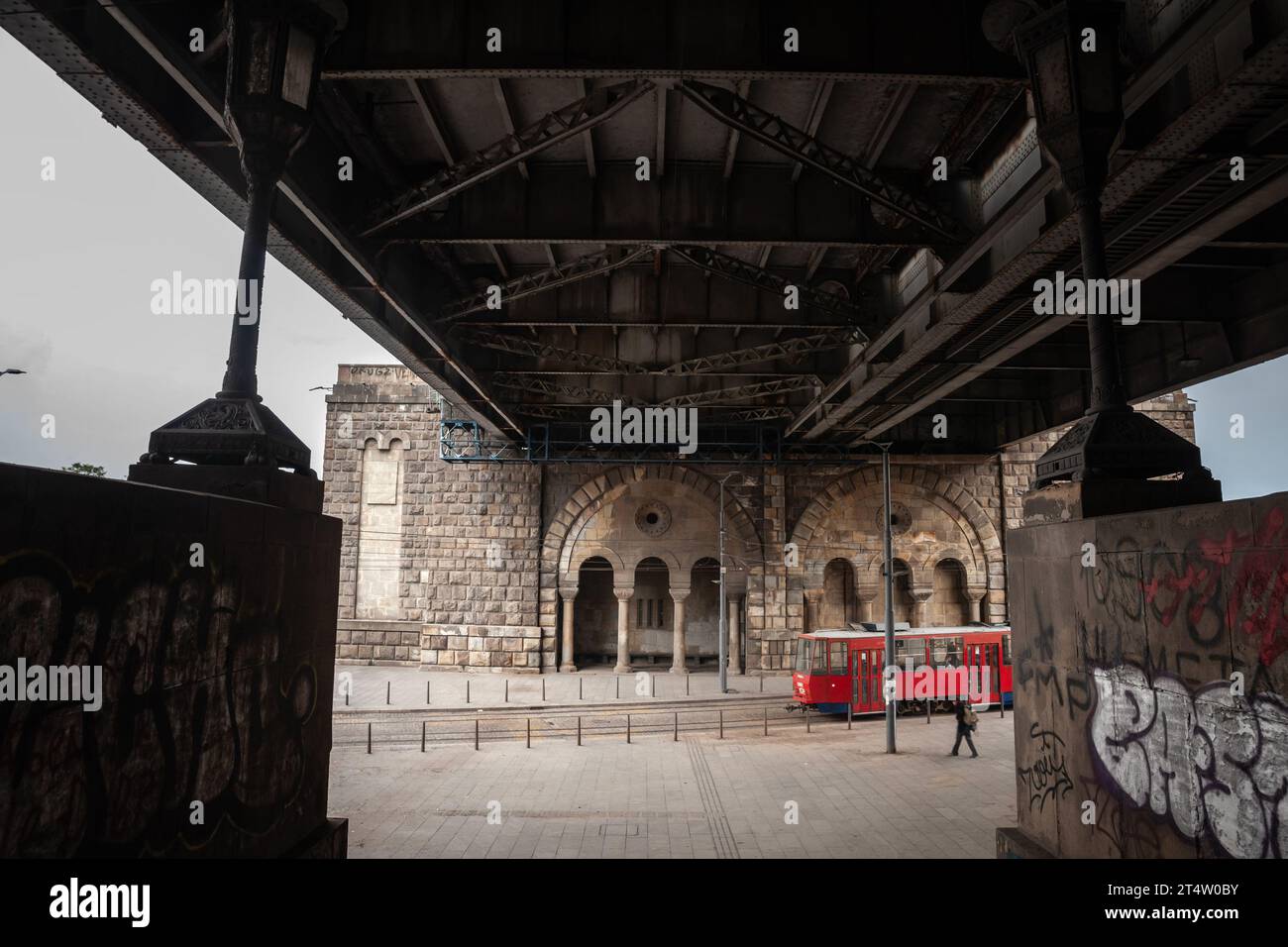 Picture of a tram passing under the brankov most bridge of belgrade ...