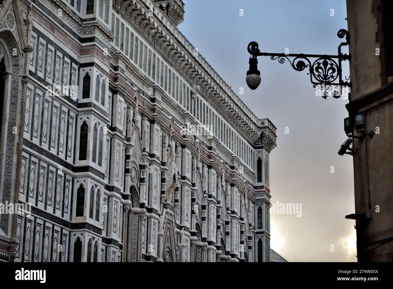 A vibrant city skyline featuring numerous buildings, illuminated by a ...