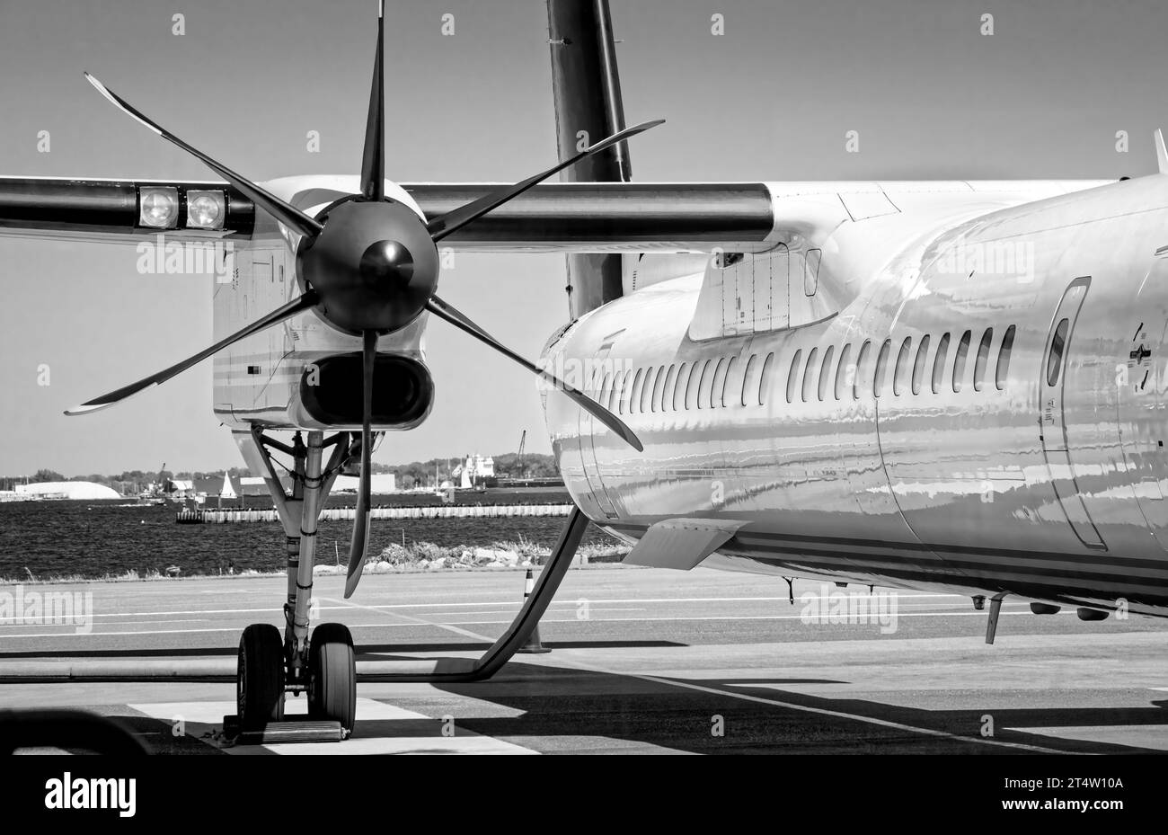 Close-up of black six-bladed propeller and part of wing and fuselage of ...