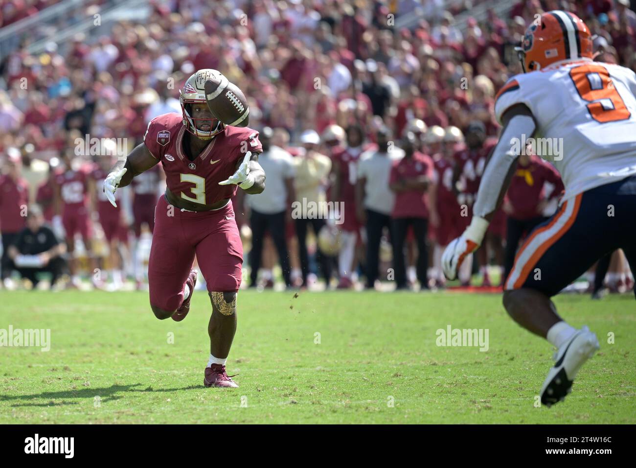 Florida State running back Trey Benson (3) misses a pass in front of ...