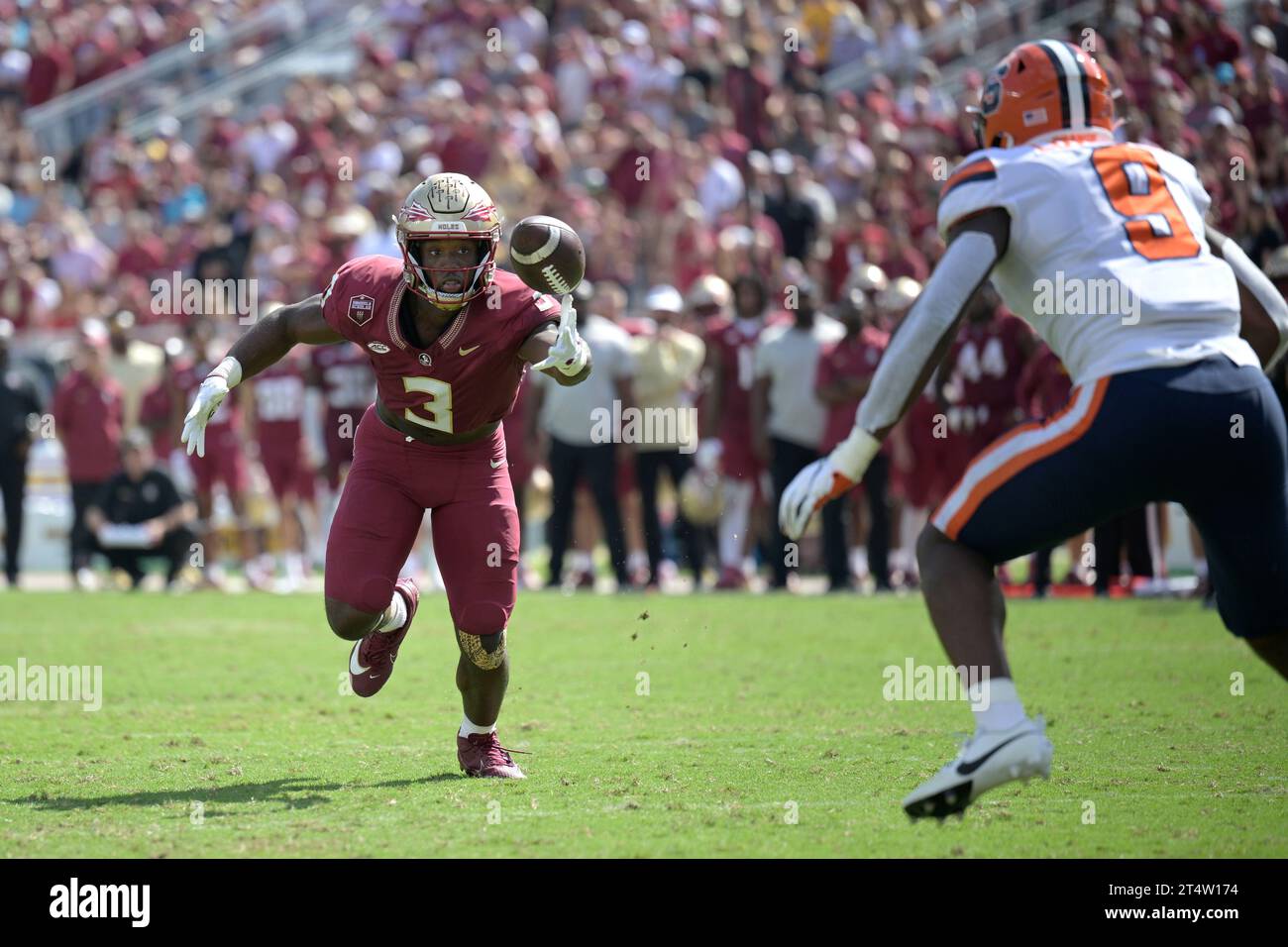 Florida State running back Trey Benson (3) misses a pass in front of ...