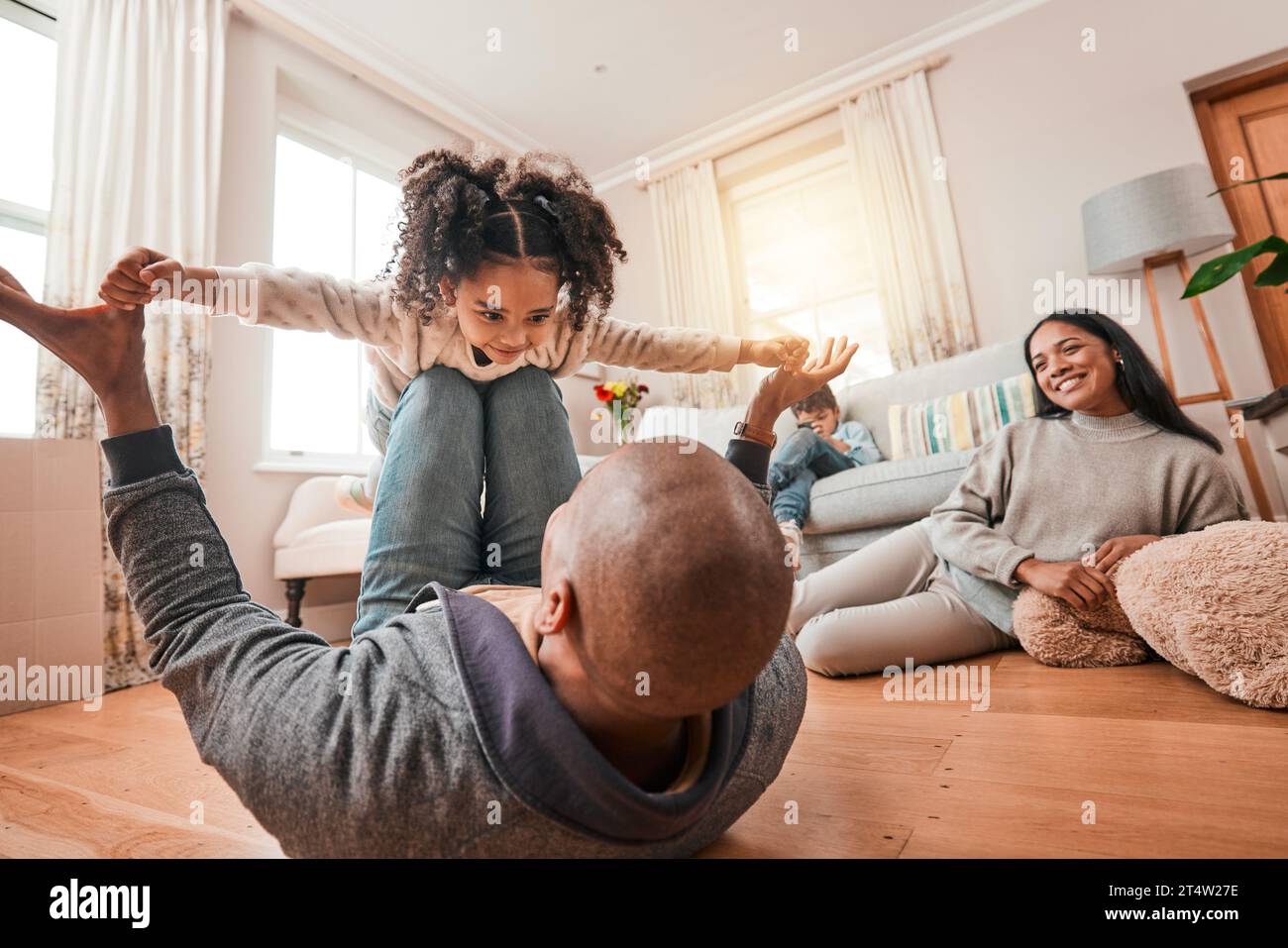 Happy, relax and airplane with family on floor of living room for funny ...