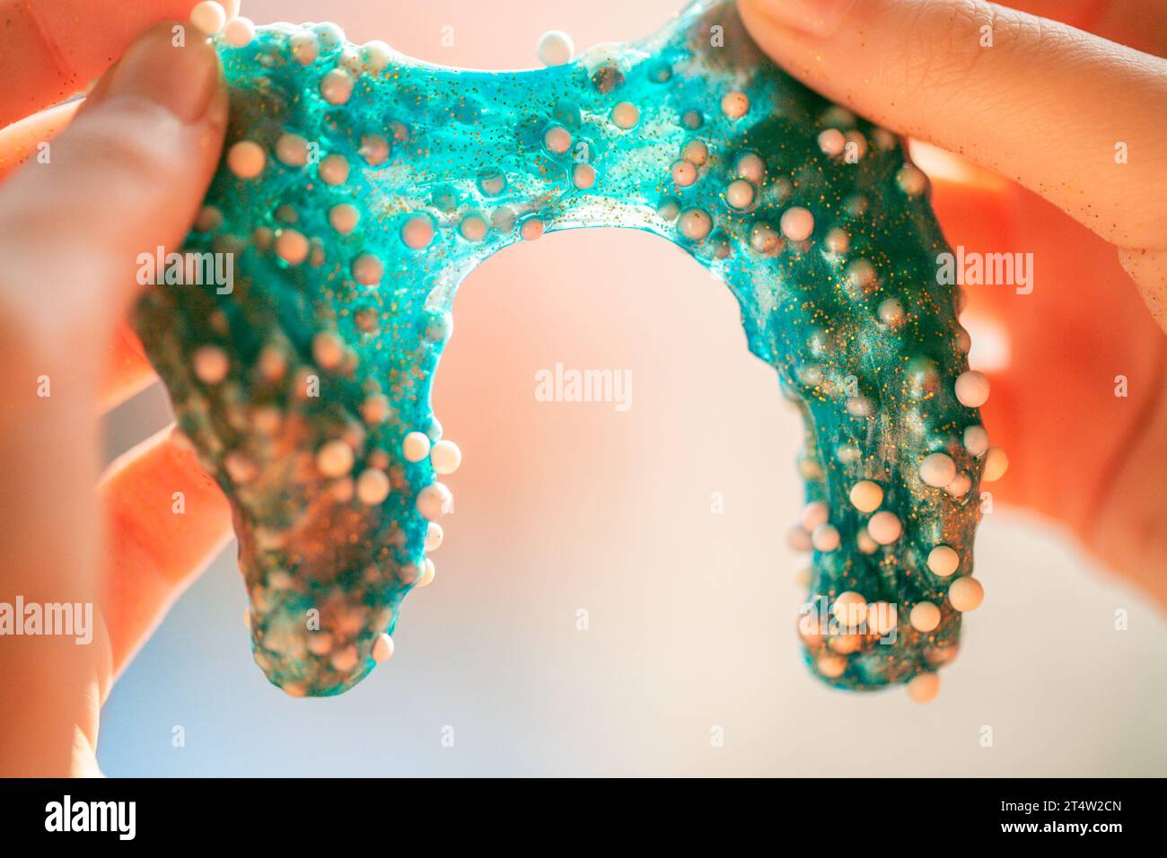 slime in childrens hands .Soft plasticine in hands.Childrens creativity ...