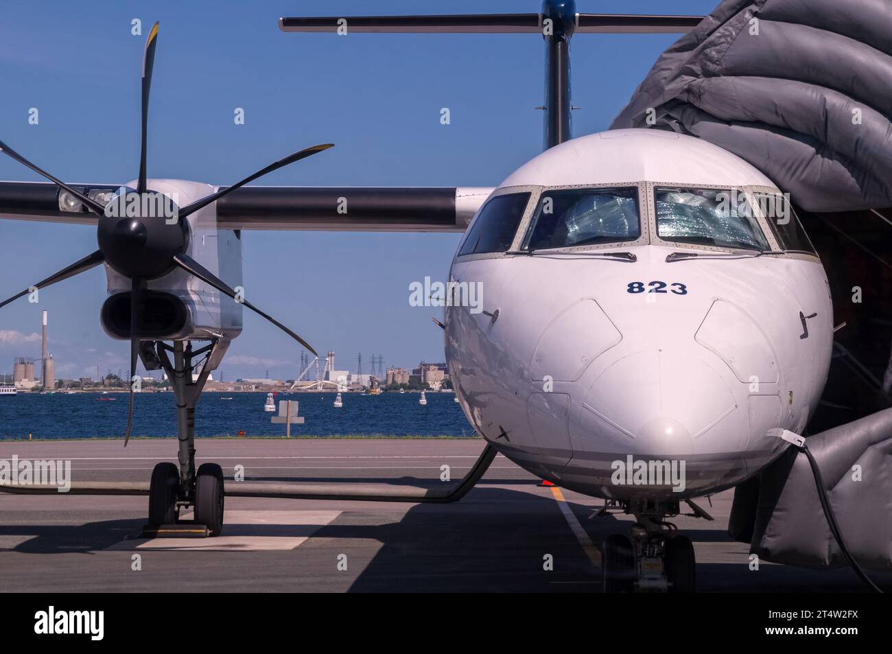 Front view of white modern turboprop airliner with close-up of pointed ...